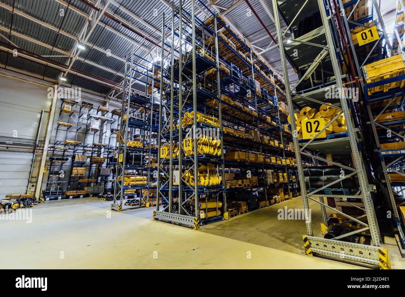 Modern warehouse interior with shelves and boxes Stock Photo - Alamy