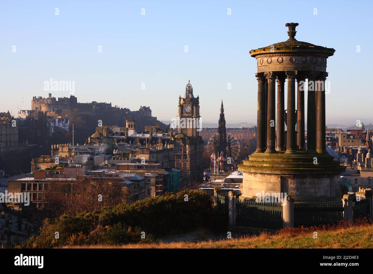 A scenic view of the famous Edinburgh ruins against the old city of ...