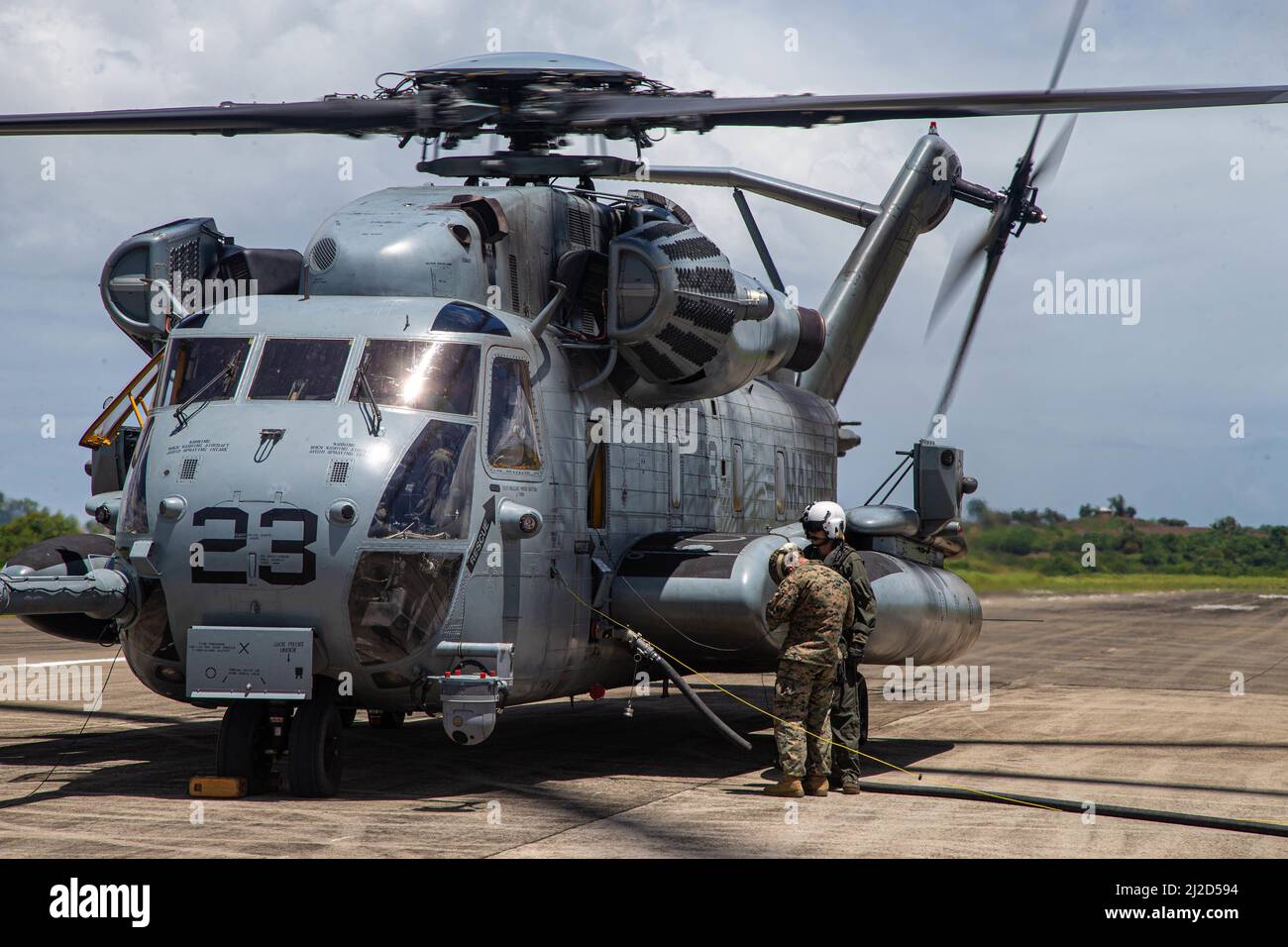 U.S. Marines assigned to Marine Heavy Helicopter Squadron 466 (HMH-466), refuel a CH-53E Super ...