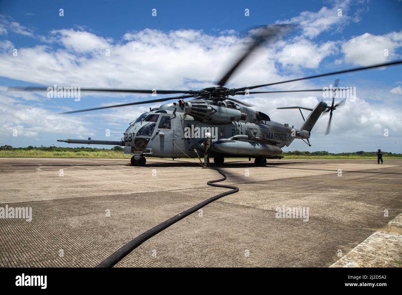 U.S. Marines assigned to Marine Heavy Helicopter Squadron 466 (HMH-466), refuel a CH-53E Super ...