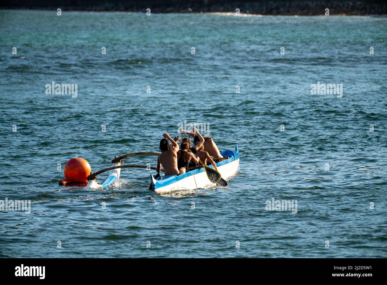 teamwork of people in an ocean canoe Stock Photo - Alamy