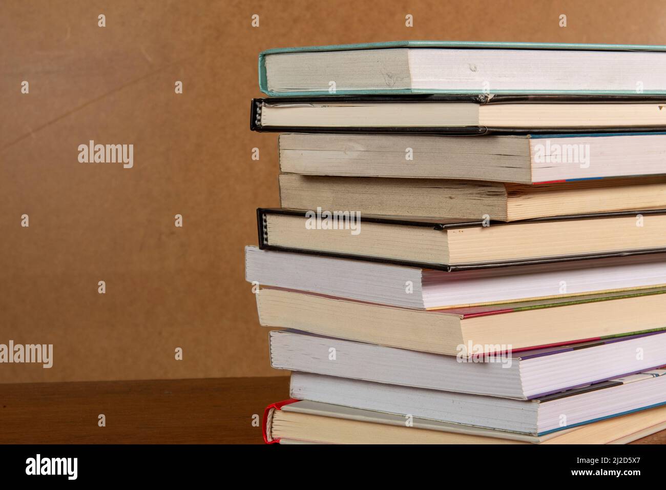 Close-up of background stack of old used books. Pile of vintage old ...