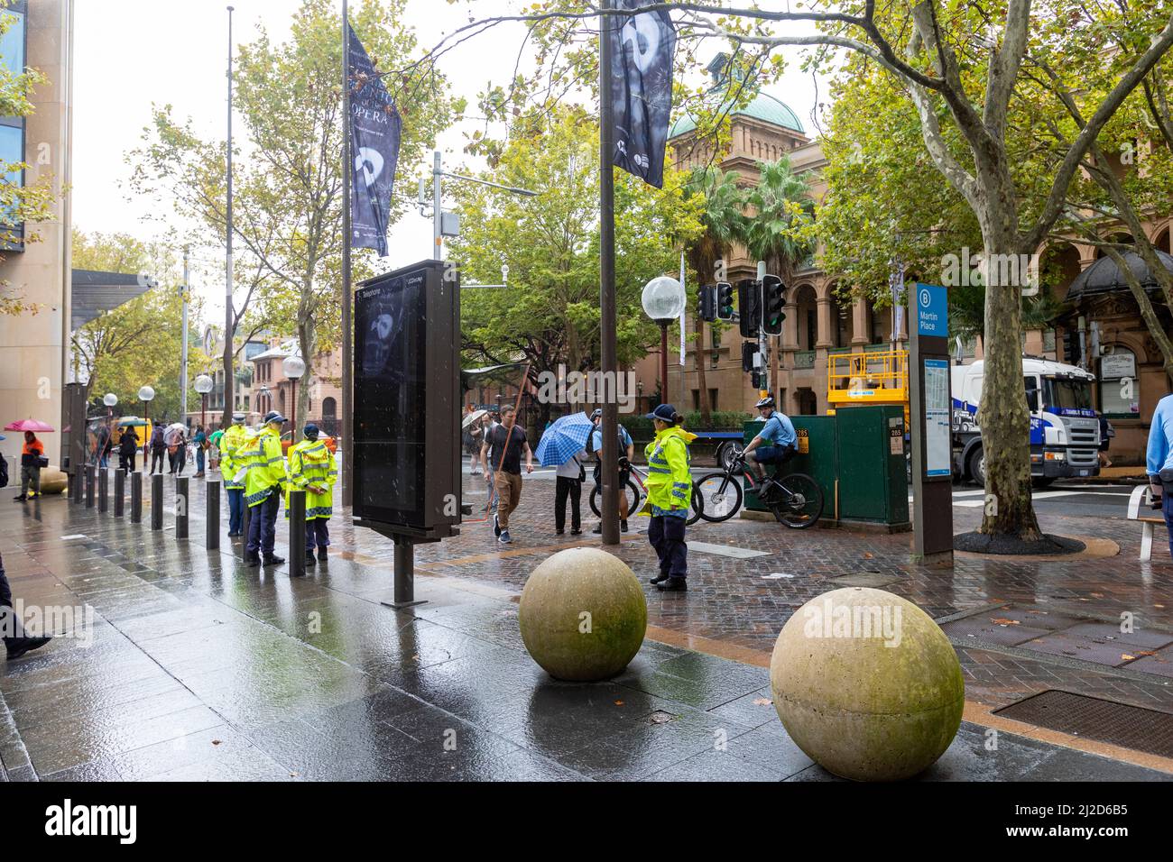 Australian police officers in Sydney watch over a small protest at NSW ...