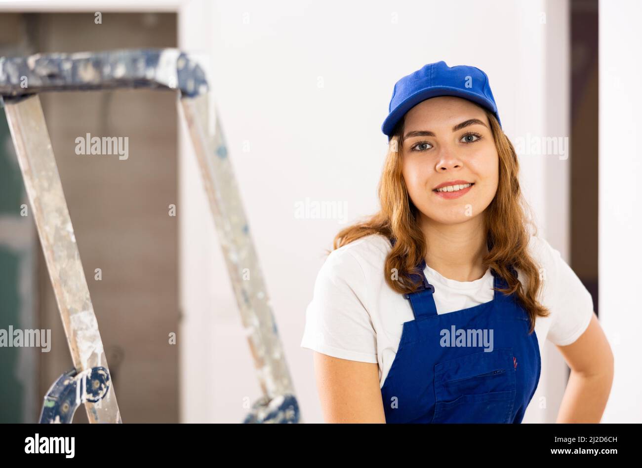 Enthusiastic young female builder inside house under construction Stock ...