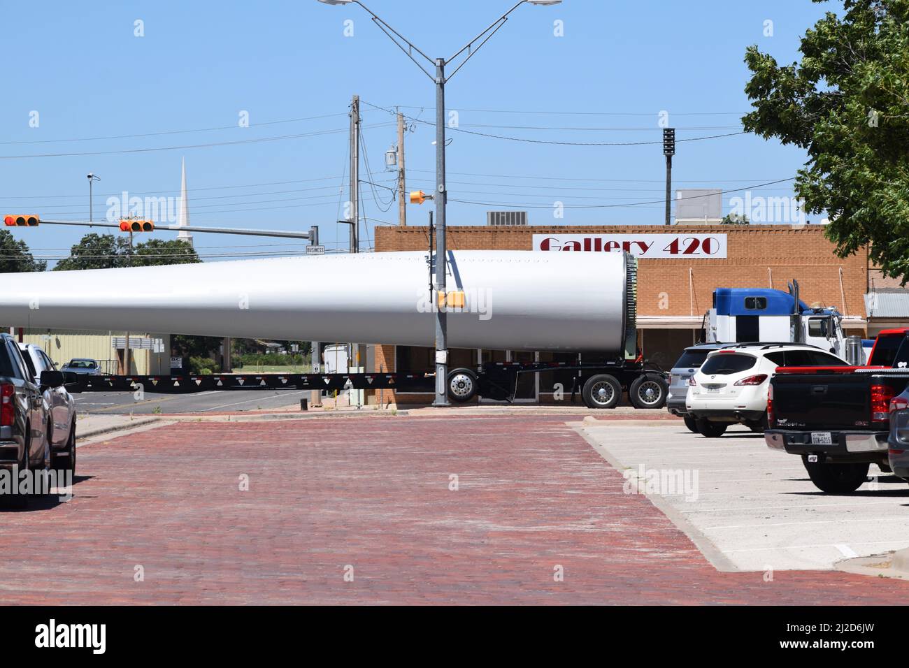 Large windmill blade being transported via truck through Haskell, Texas ...
