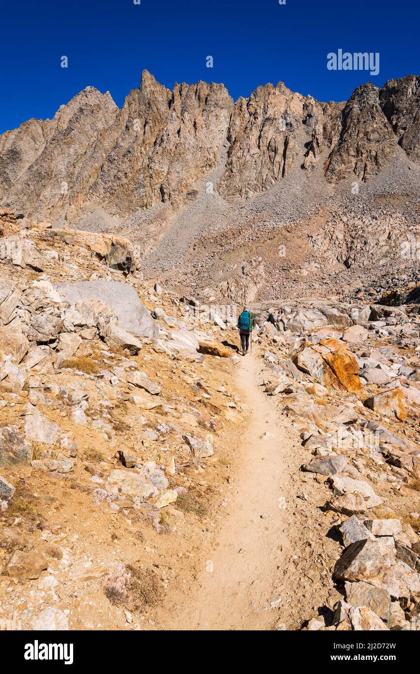 Backpacker crossing Bishop Pass, John Muir Wilderness, California USA ...