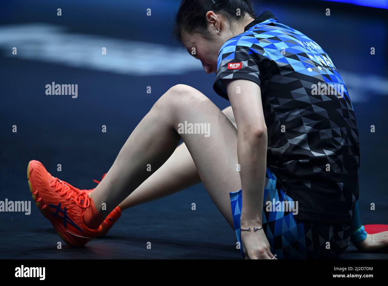 Doha, Qatar. 31st Mar, 2022. Han Ying of Germany falls to the ground ...