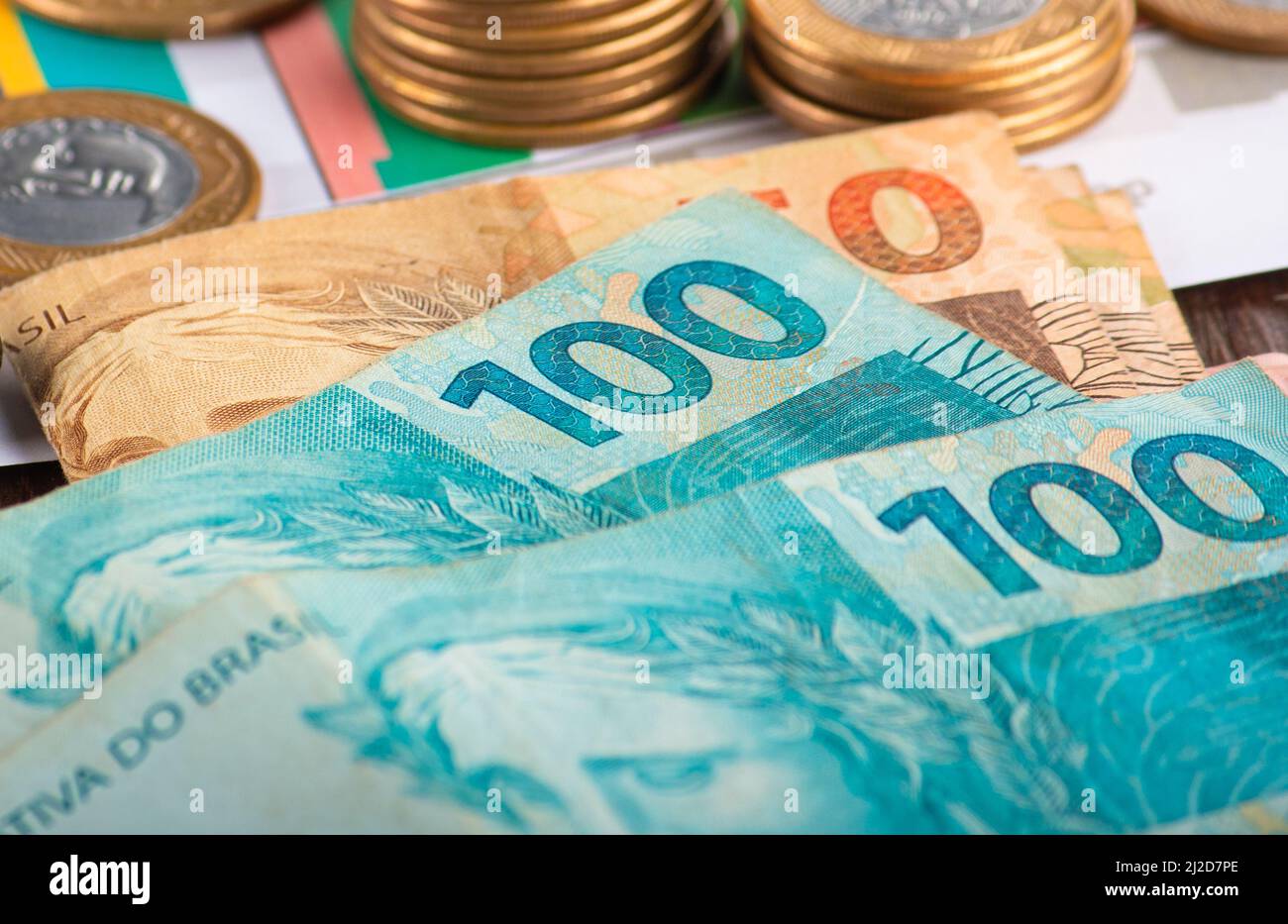 Finance concept. Brazilian money banknotes and coins Stock Photo - Alamy