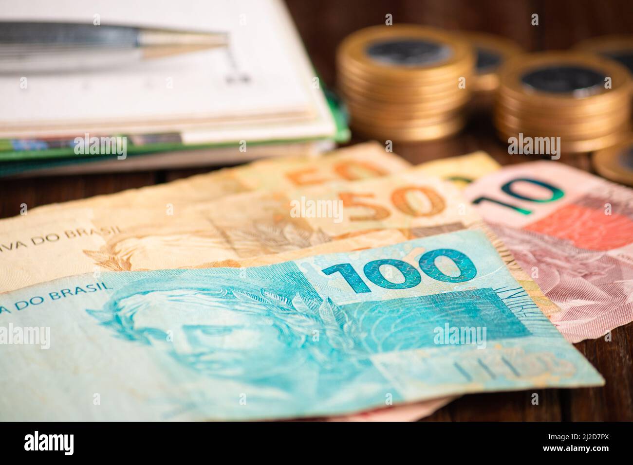Finance concept. Brazilian money banknotes and coins Stock Photo - Alamy