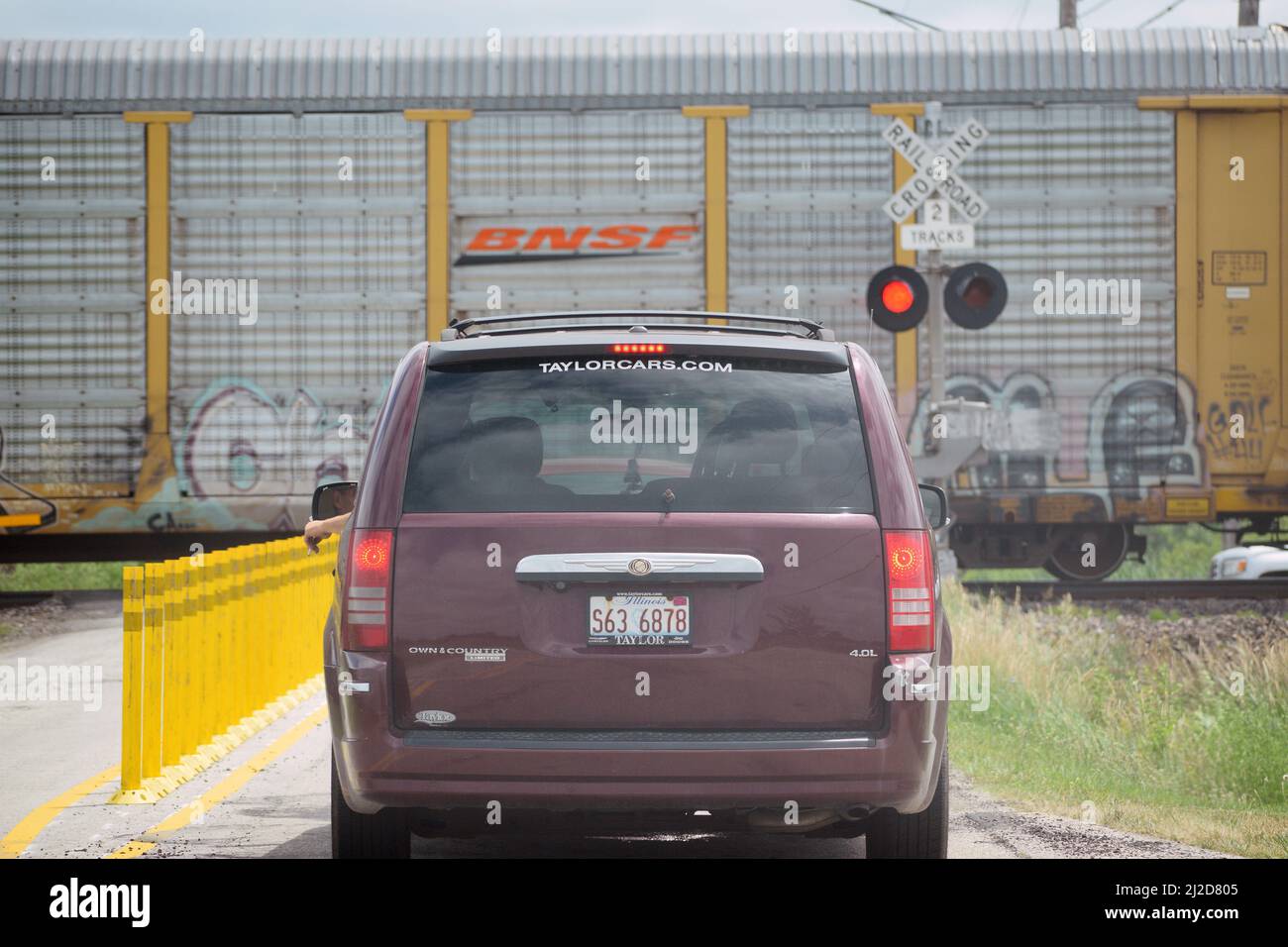 Minivan stopped at a railroad crossing just west of Beecher, Illinois ...
