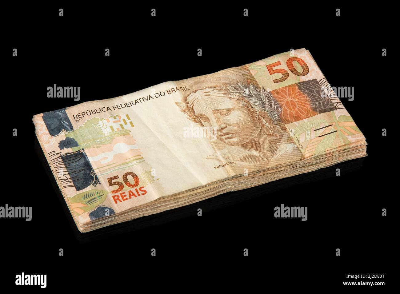Brazilian money. 50 reais banknotes. Brazilian finance concept. Black ...