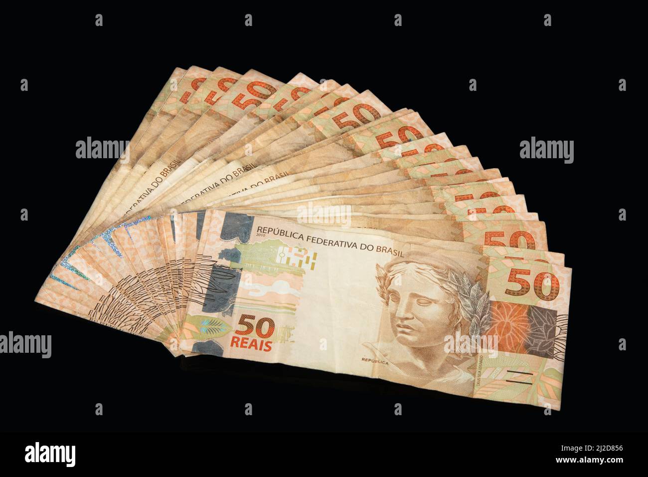 Brazilian money. 50 reais banknotes. Brazilian finance concept. Black ...
