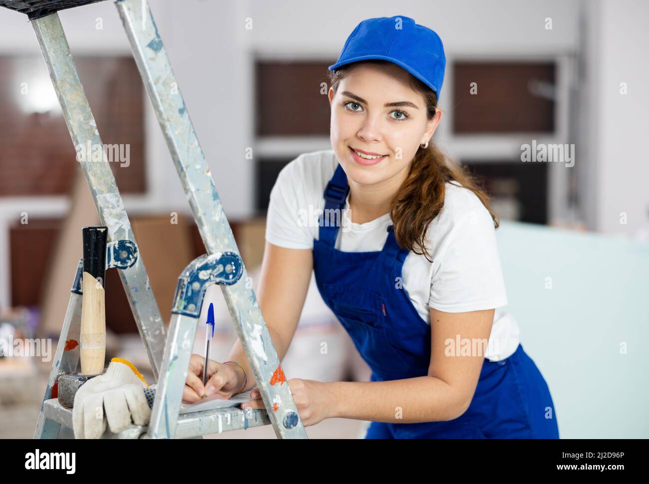 Woman foreman signs an act of acceptance of completed work Stock Photo ...