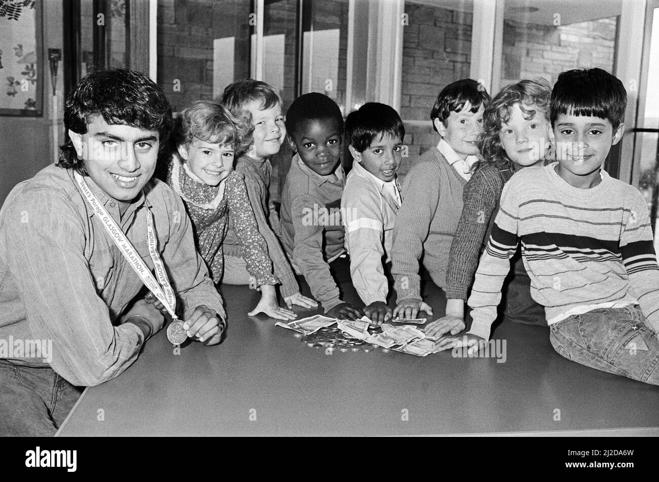 All smiles from marathon runner Tony Gill and some of the pupils at the ...