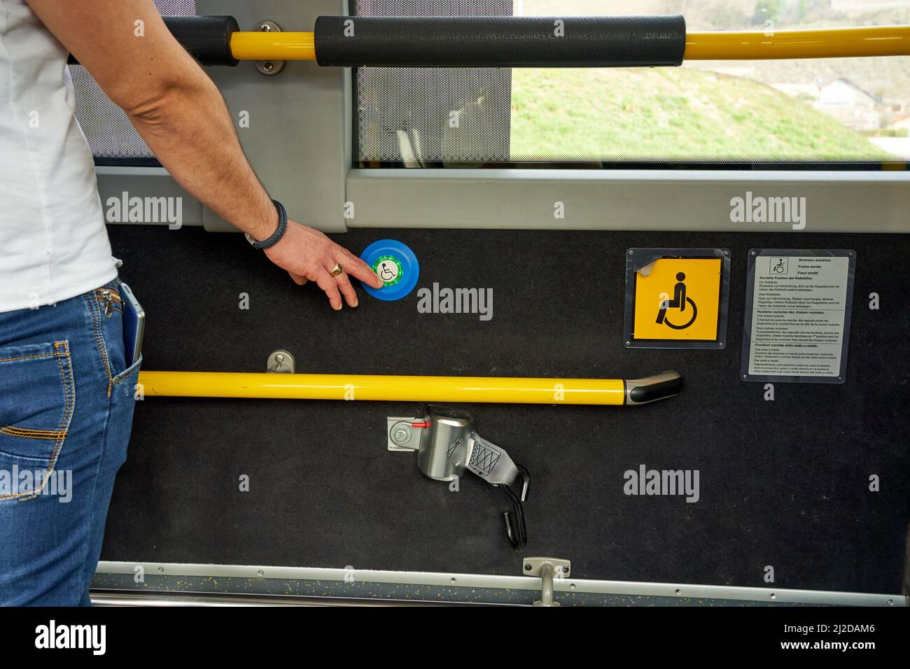 An adult Caucasian man pushing the blue button of the disabled people ...