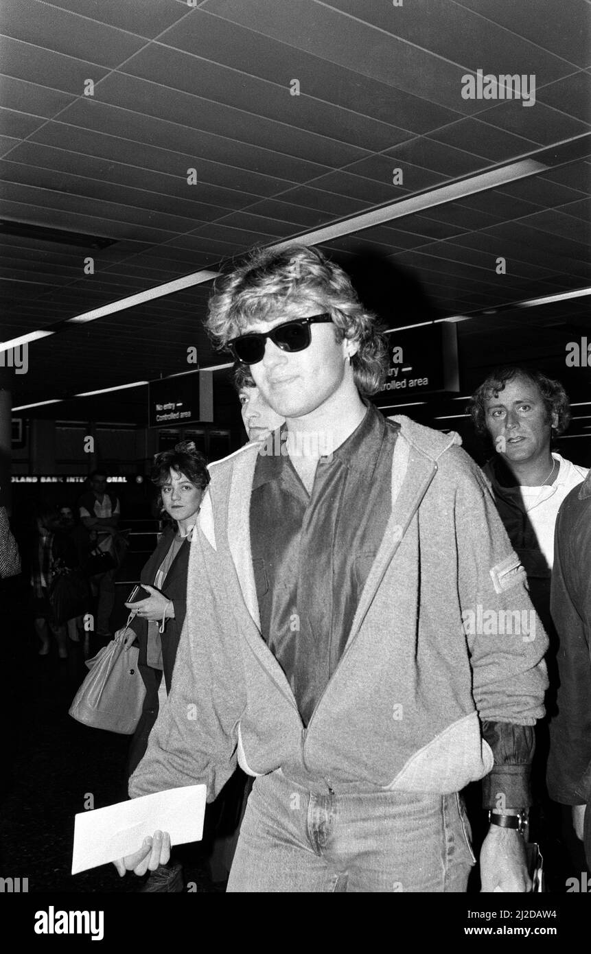 George Michael of the pop group Wham!, arriving at Gatwick airport on ...