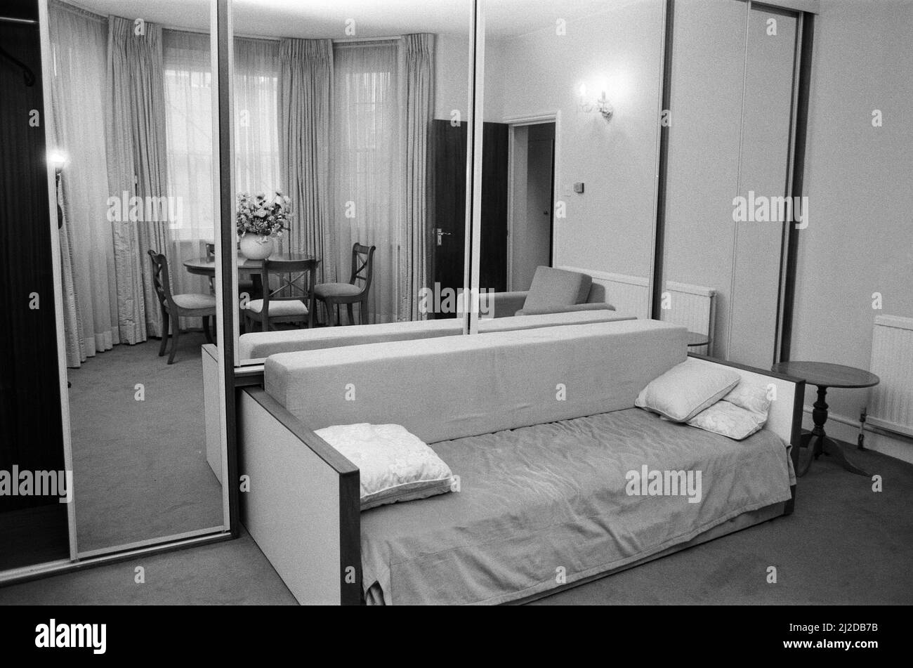 Interior view of a flat, showing the living room area, mirrored ...