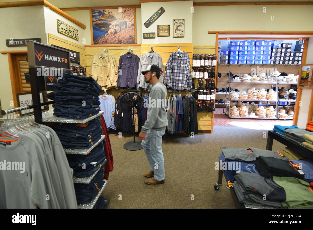 A Gen Z man browsing through a western wear store, The Wrangler, in ...