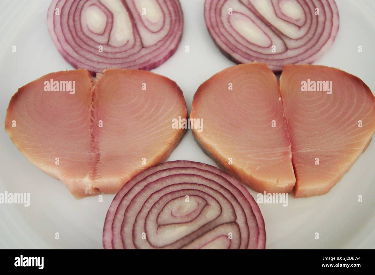 Pickled tunny (Turkish: Lakerda) and onion on the dinner plate Stock ...