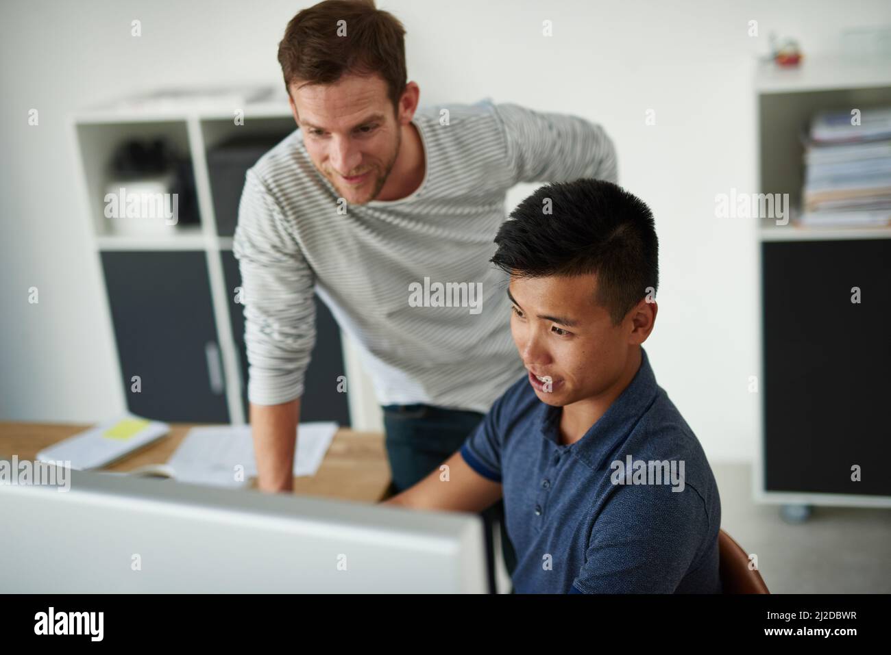 Their success is built on teamwork. High angle shot of two designers ...