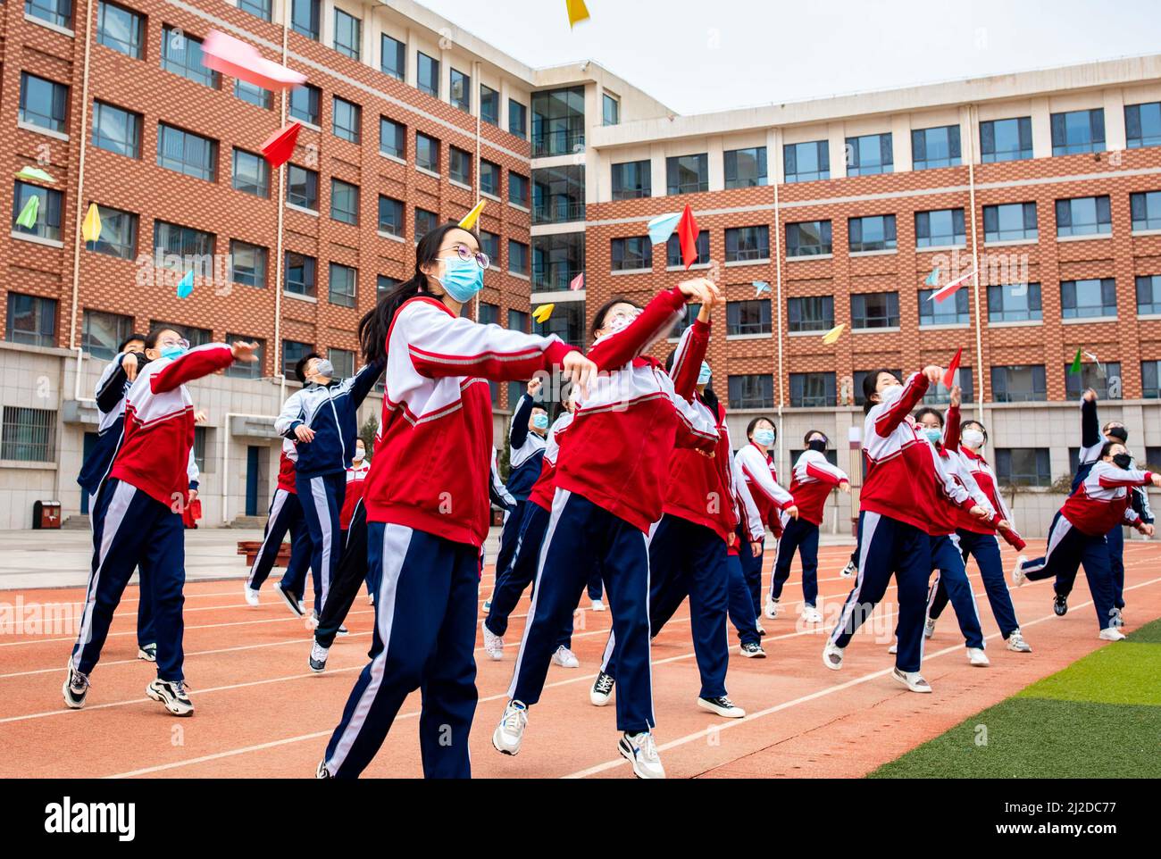 HOHHOT, CHINA - APRIL 1, 2022 - Students wearing masks exercise during ...