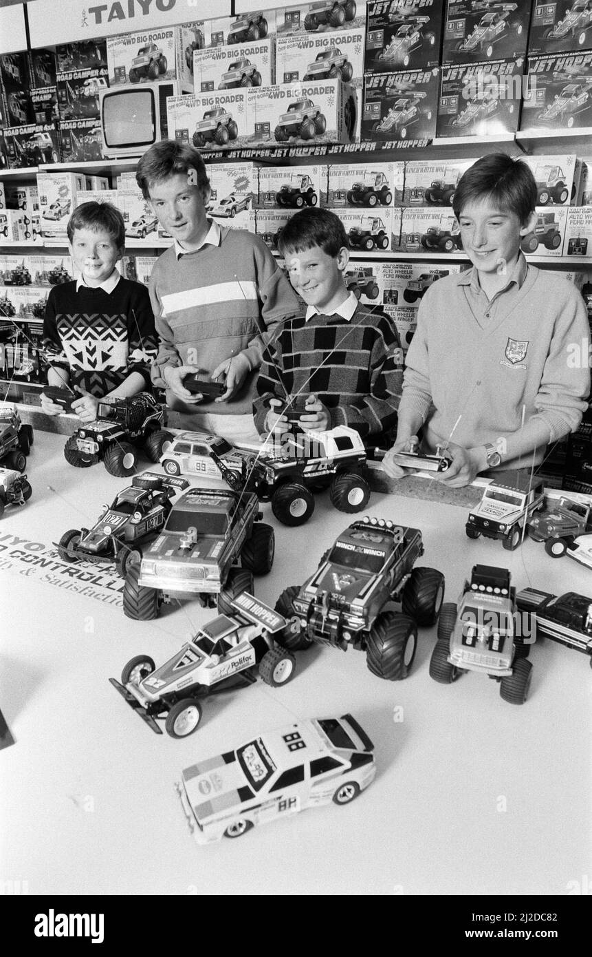 Young boys playing with toy remote control cars in Hamley's, London ...