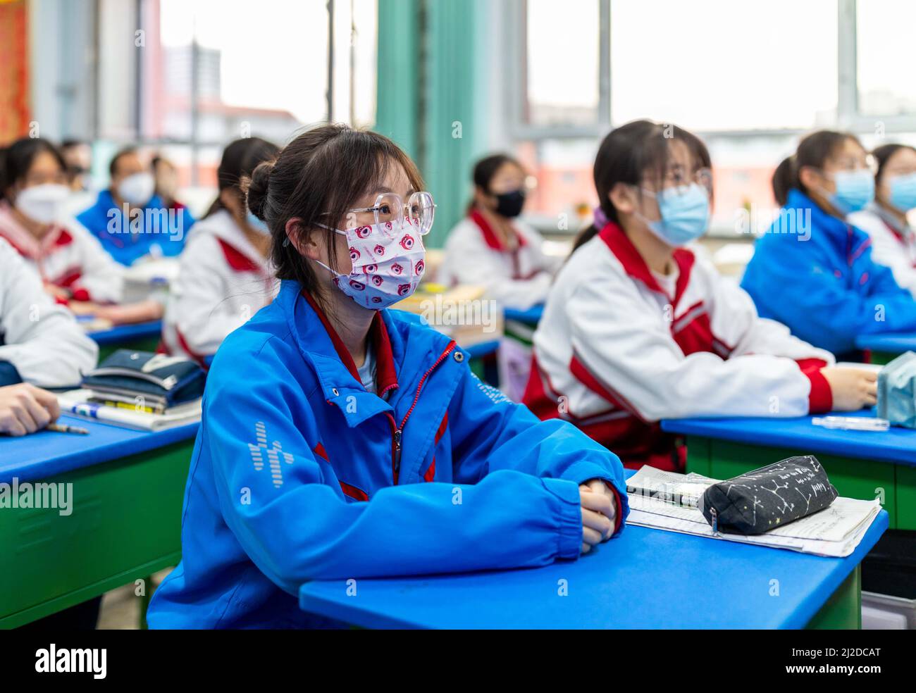 HOHHOT, CHINA - APRIL 1, 2022 - Students wear masks to study in a ...