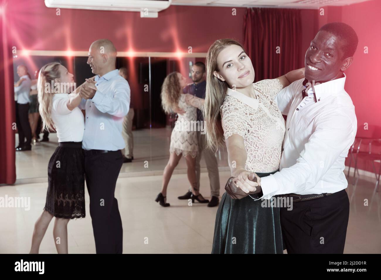 Young people learning to technique of classical dance in dancing class ...
