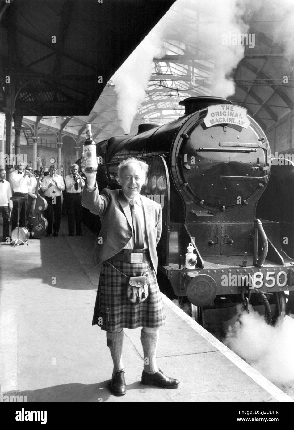 Donald Mackinlay of distillers Charles Mackinlay toasts the departure ...