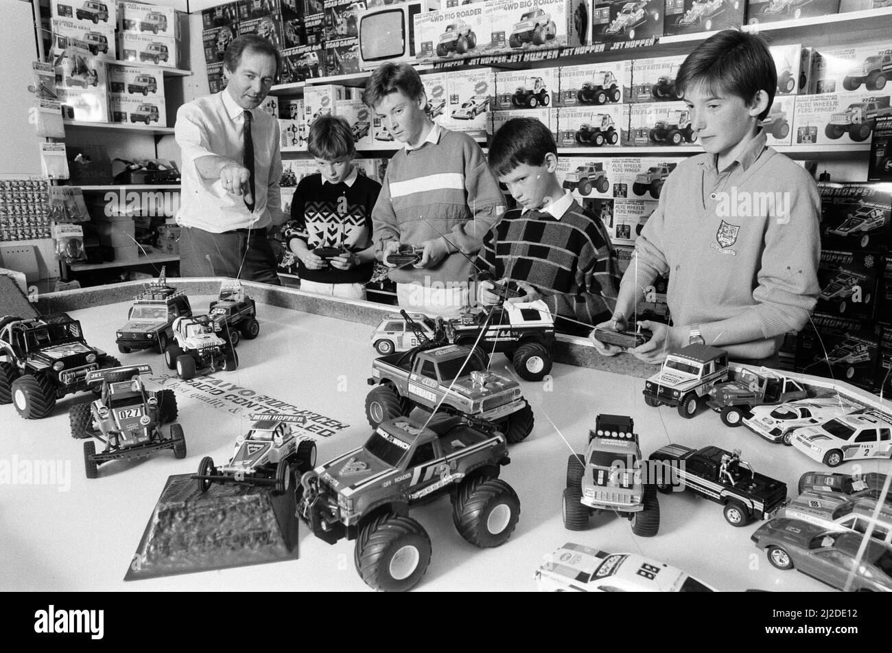 Young boys playing with toy remote control cars in Hamley's, London ...