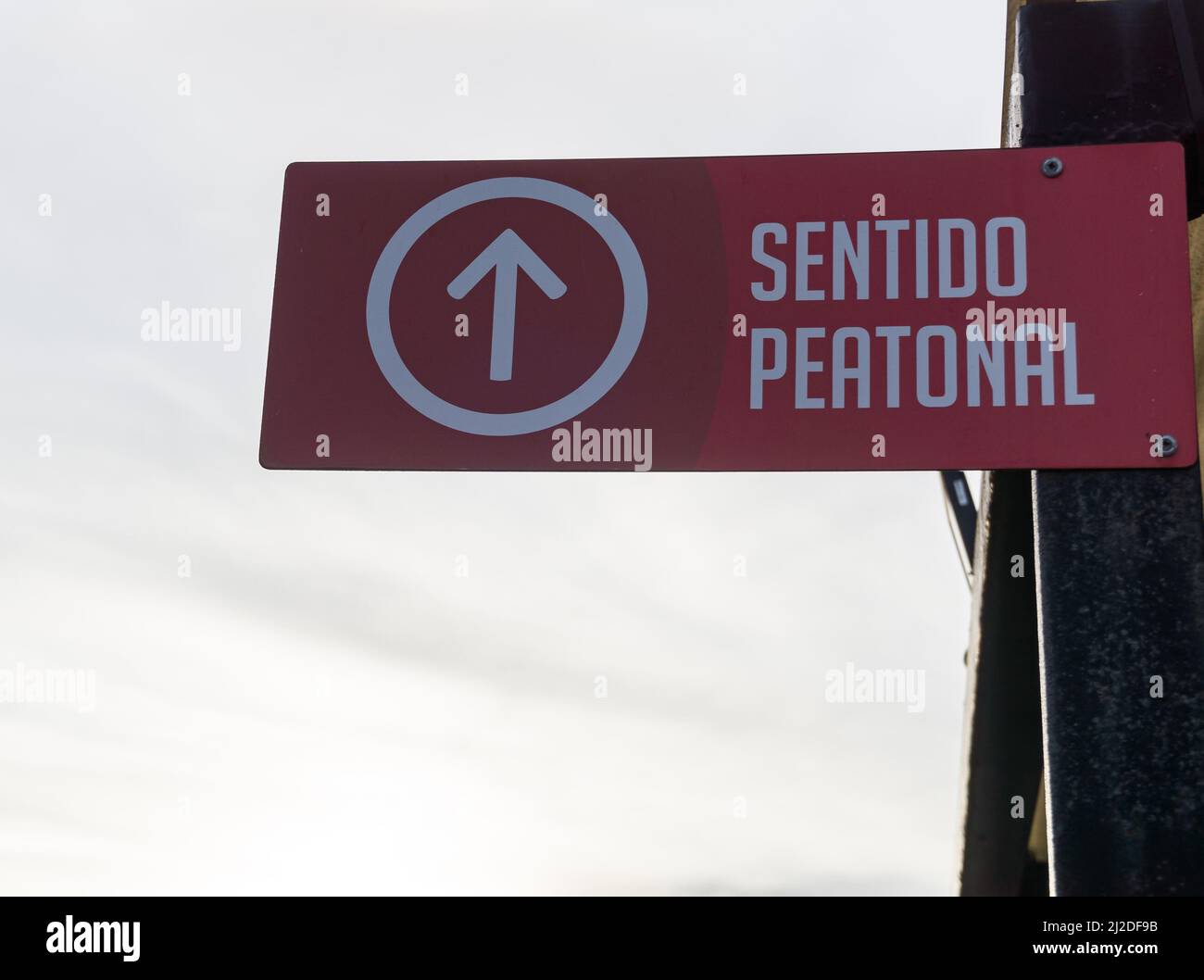 A spanish signs that reads "sentido peatonal" with an arrow Stock Photo ...