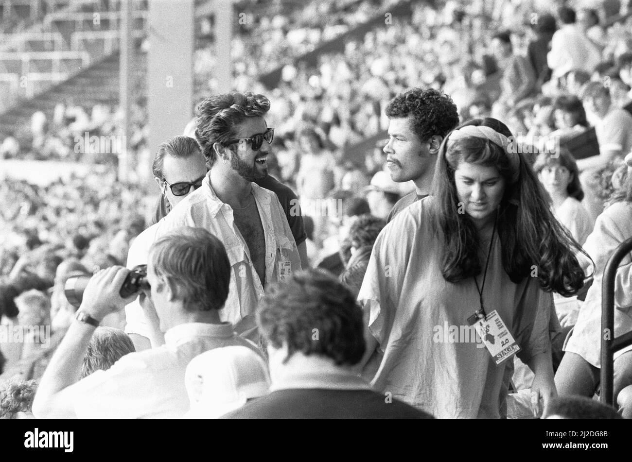 George Michael in the audience during the opening of the Live Aid ...