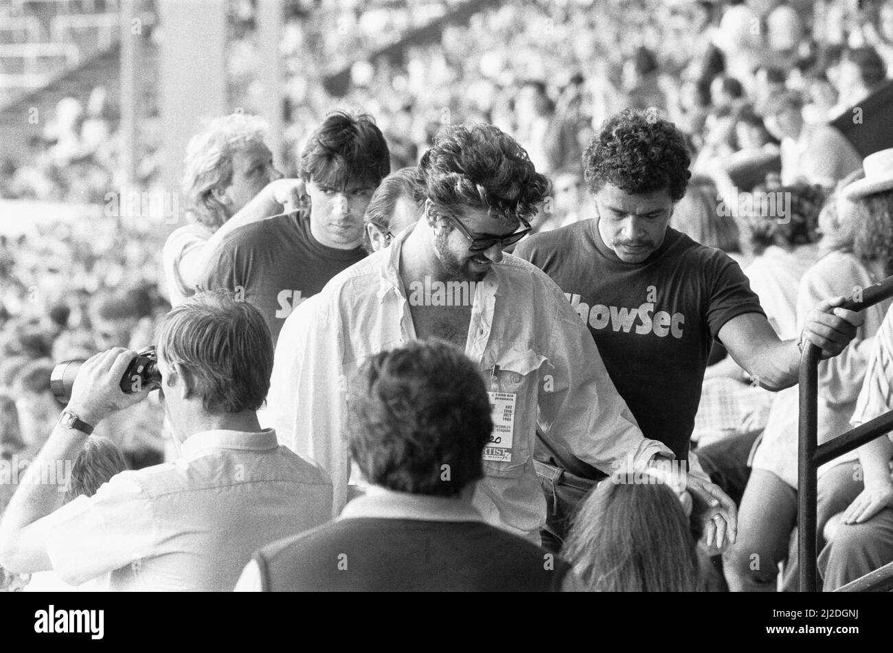 George Michael in the audience during the opening of the Live Aid ...