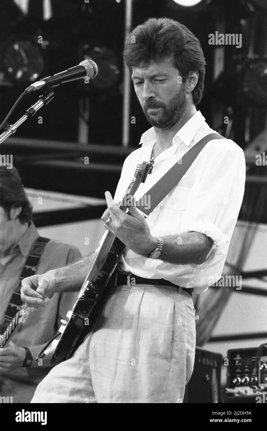 Eric Clapton performing on stage at the John F. Kennedy Stadium, Philadelphia, during the Live ...
