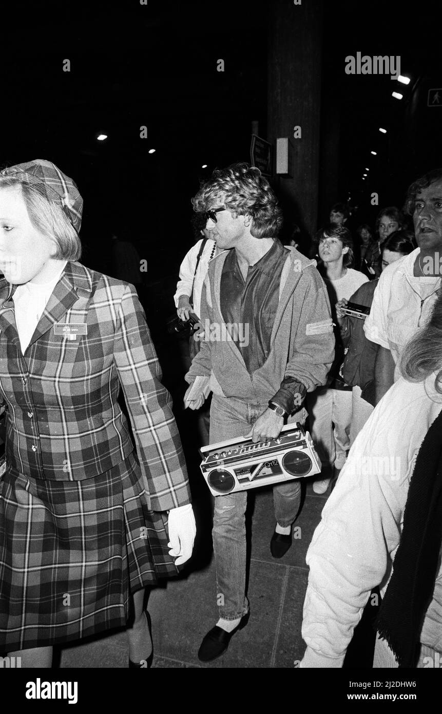 George Michael of the pop group Wham!, arriving at Gatwick airport on ...