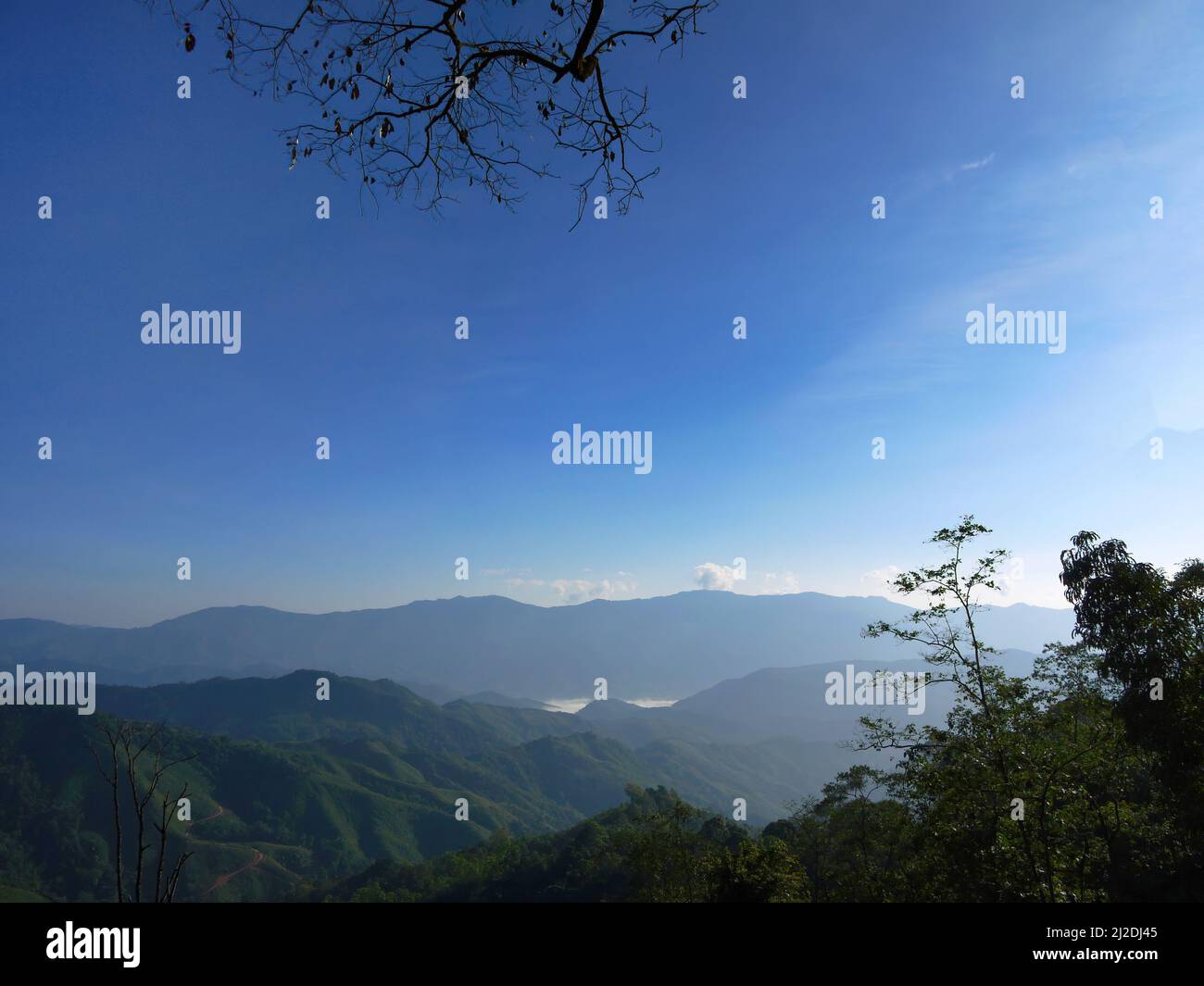 Landscape of beautiful morning mountains in layer shades and bright ...
