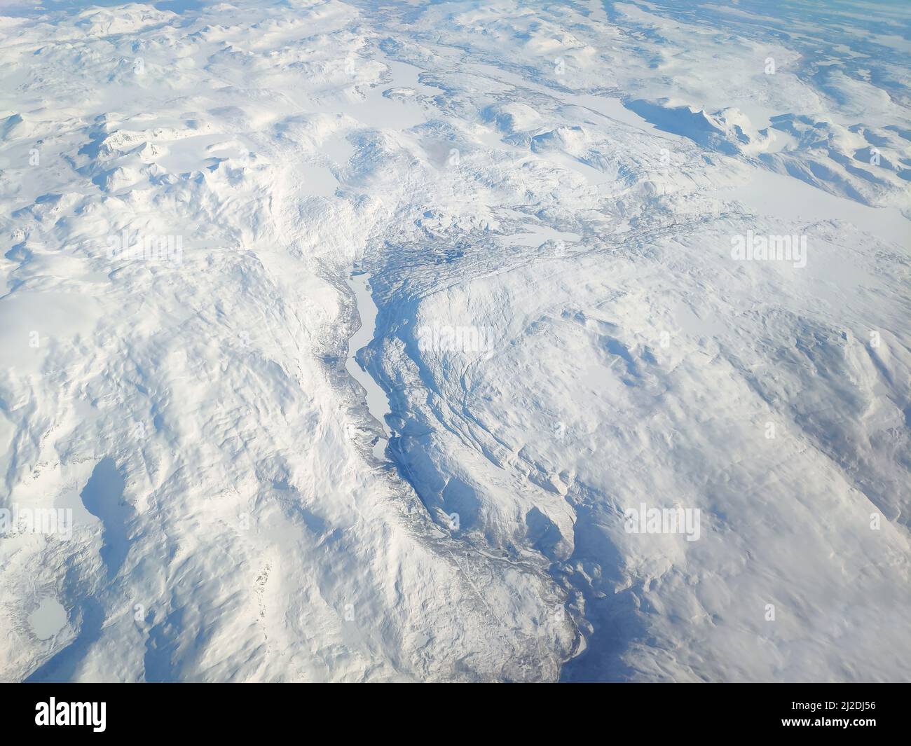 Aerial view of nature white snow covered the land of Norway in winter ...