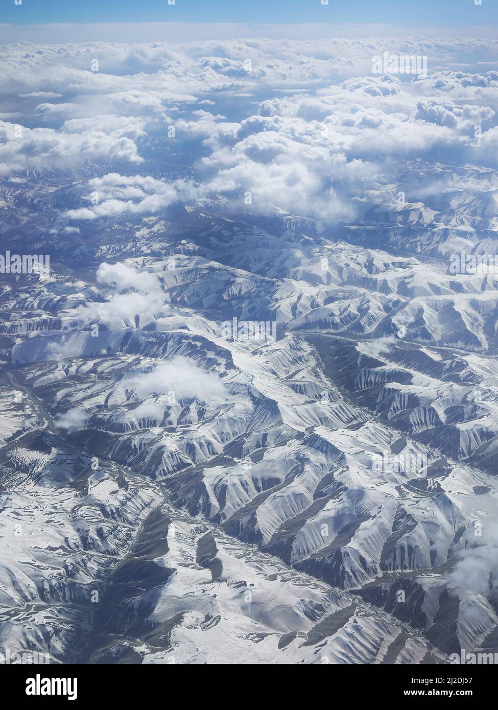 Aerial view of white snow covered mountains in winter, Snowscape ...