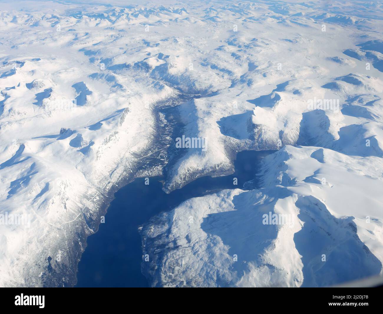 Aerial view of nature white snow covered the land of Norway in winter ...