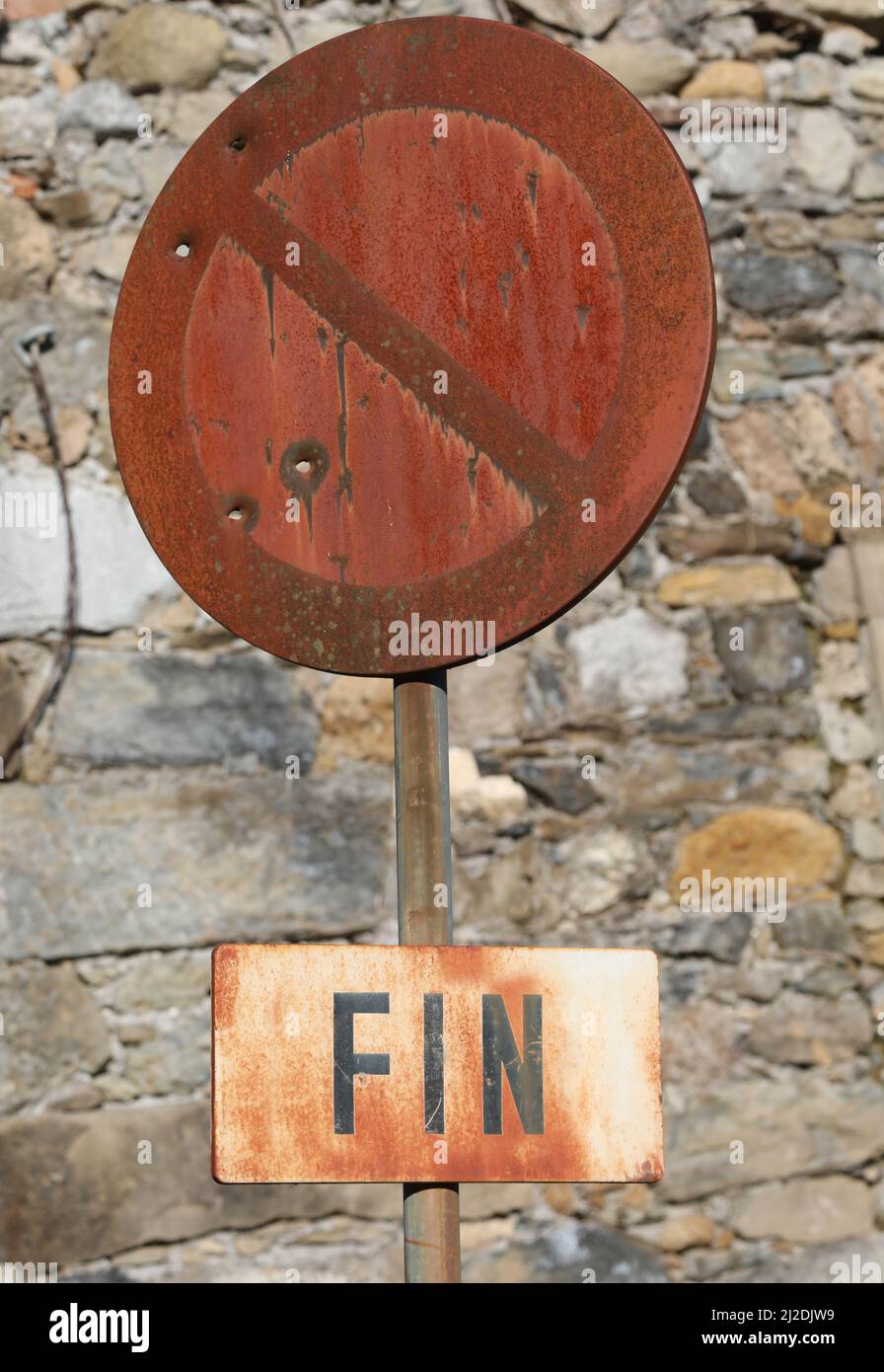 old rusted road sign with the text FIN that means THE END in France ...