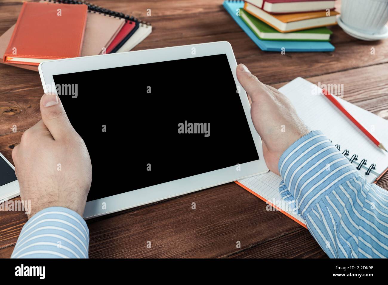 businessman with a tablet, works in the office Stock Photo - Alamy