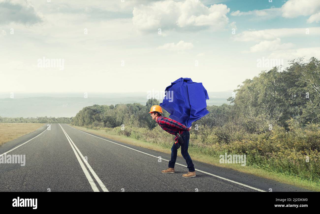 Engineer man carry load Stock Photo - Alamy