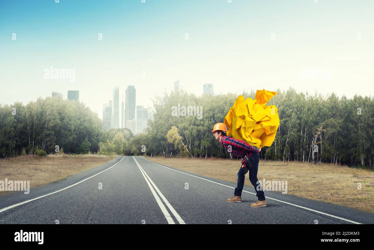 Engineer man carry load Stock Photo - Alamy