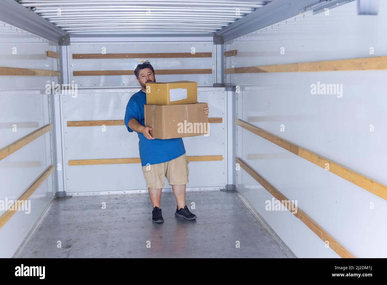 Packages delivery cardboard boxes on transportation system in car Stock ...