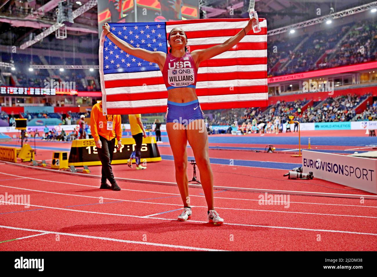 Kendell Williams (USA) poses with United States flag after finishing ...