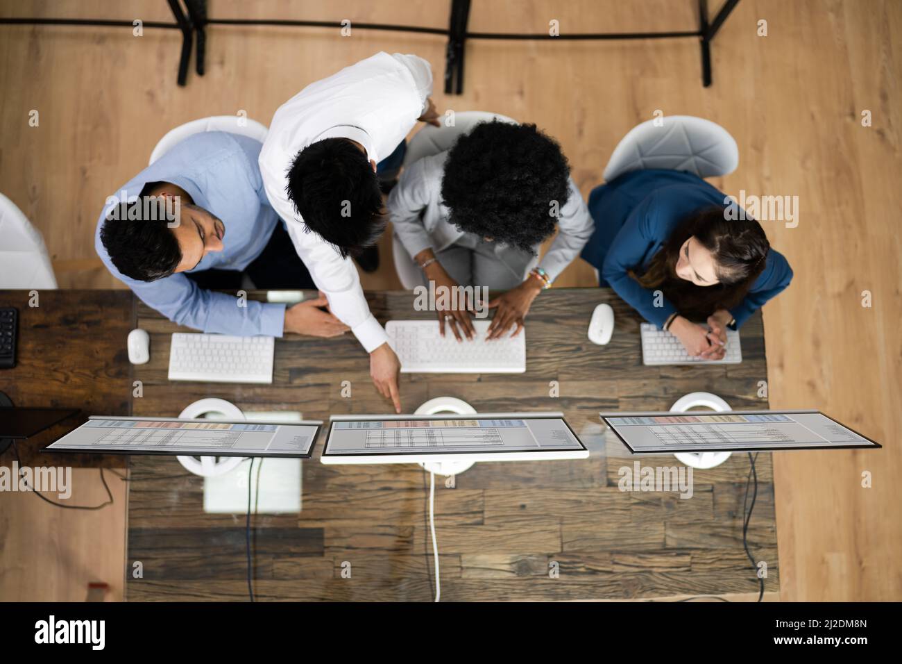 Elevated View Of Team Leader Giving Training To Her Call Center ...
