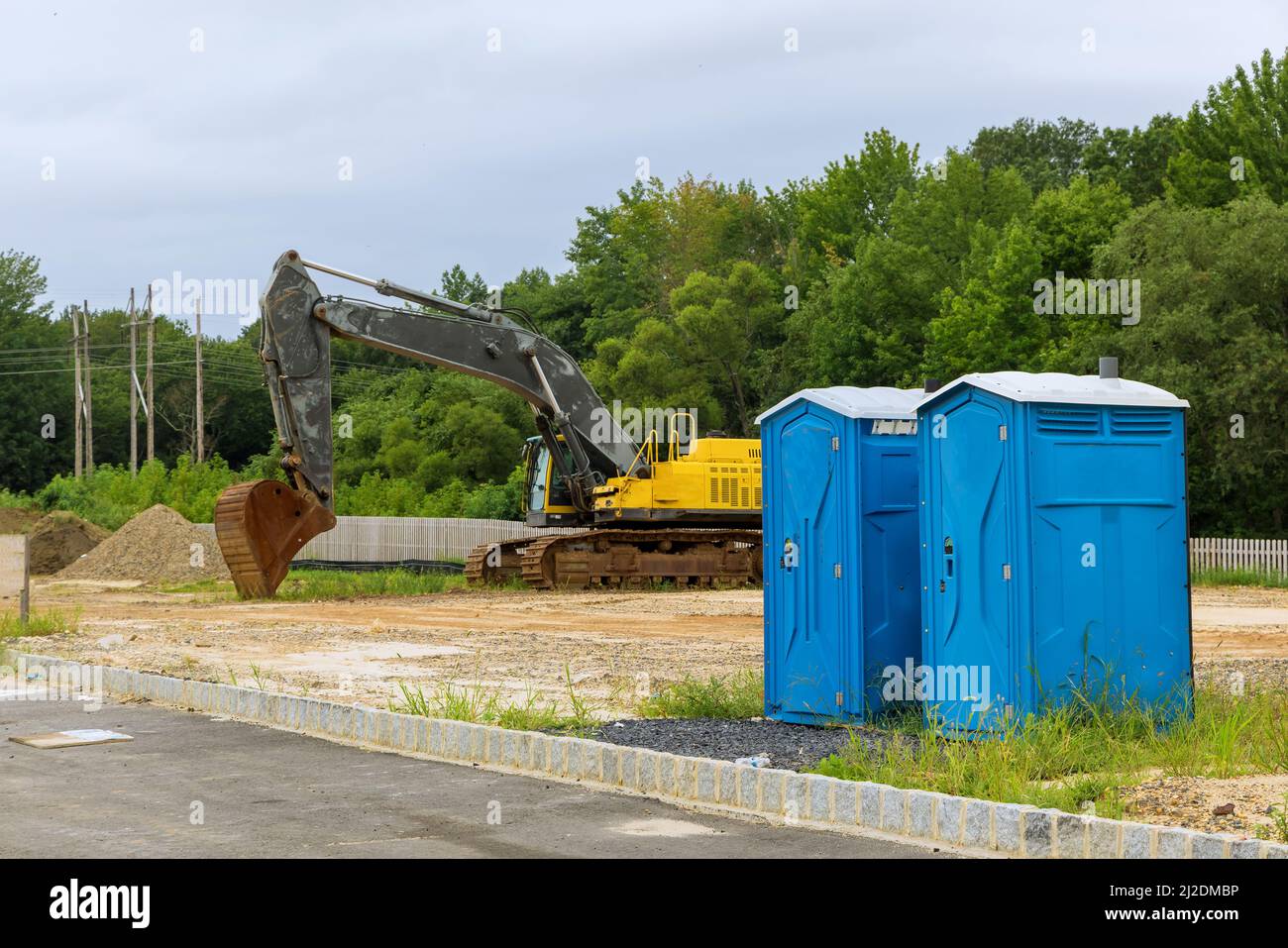 Portable restroom on house under construction in construction site for ...