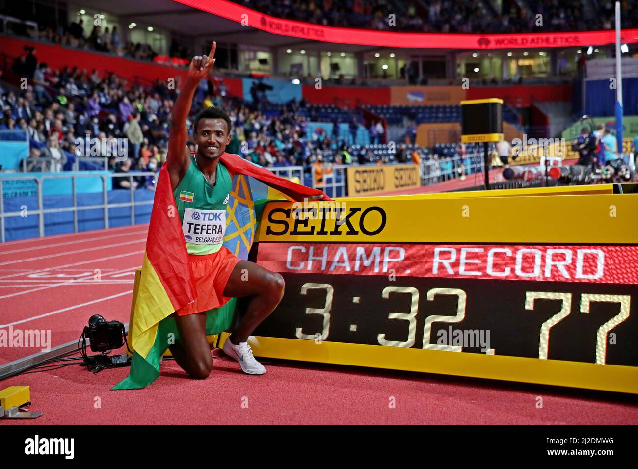 Samuel Tefera (ETH) poses with scoreboard after winning the 1,500m in a ...