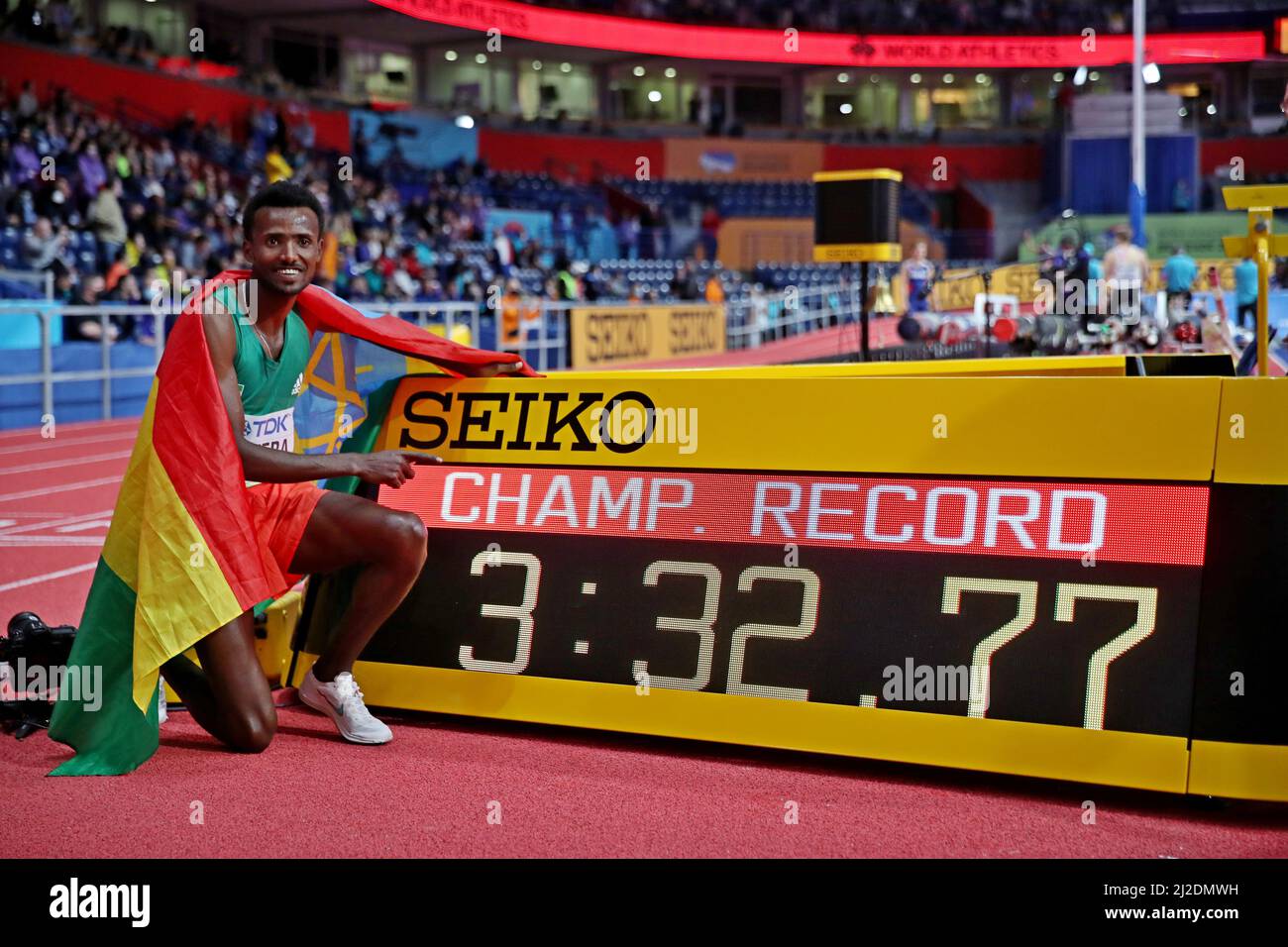 Samuel Tefera (ETH) poses with scoreboard after winning the 1,500m in a ...