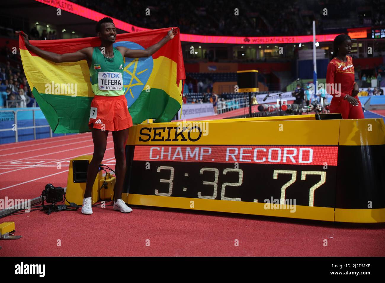 Samuel Tefera (ETH) poses with scoreboard after winning the 1,500m in a ...